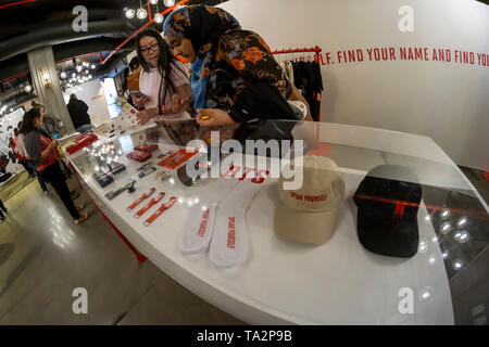 Fans of the Koran K-Pop band BTS shop for band â€œmerchâ€ at a pop-up ...