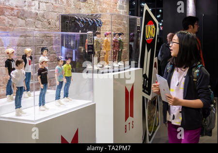 Fans of the Koran K-Pop band BTS shop for band â€œmerchâ€ at a pop-up ...