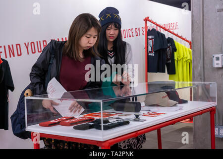 Fans of the Koran K-Pop band BTS shop for band “merch” at a pop-up shop ...