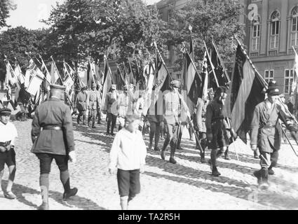 People carrying national flags marching at All Under One Banner AUOB ...