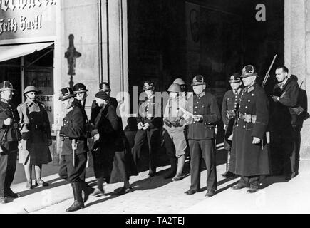 A soldier of the German military police and German policemen of the so ...