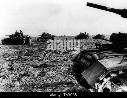 German tanks advance against Soviet settlements in October 1941. The ...