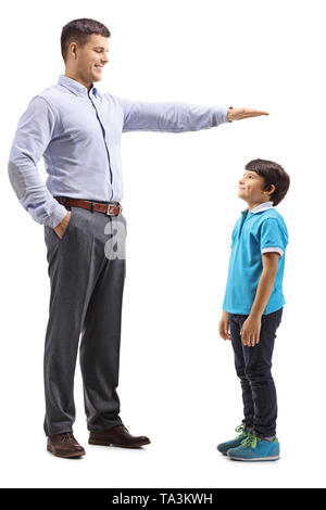 Man measuring the height of a boy isolated on white background Stock ...