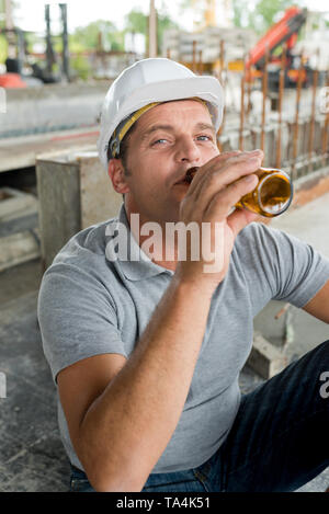 builder drinking beer Stock Photo - Alamy