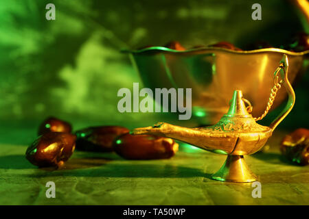 Aladdin lamp of wishes and dates for Ramadan on red background Stock ...