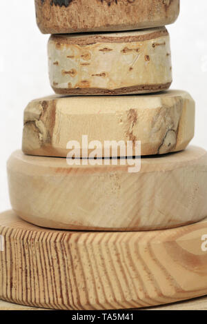 A wooden pyramid of treated wood on a white background with a place for ...