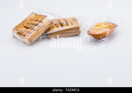 pre packaged snacks and pastries on a blank surface Stock Photo - Alamy
