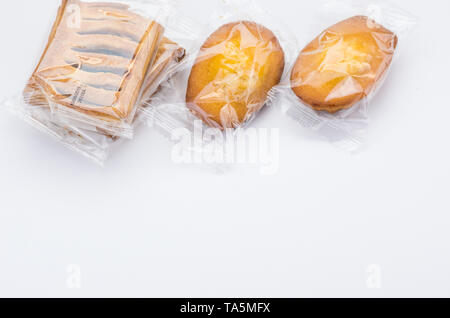 pre packaged snacks and pastries on a blank surface Stock Photo - Alamy