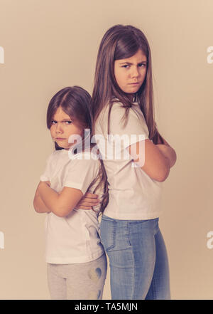 Portrait of siblings interacting having an argument. Older sister ...