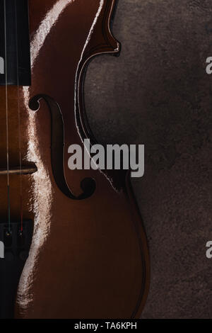 classical violoncello in darkness on textured surface Stock Photo - Alamy