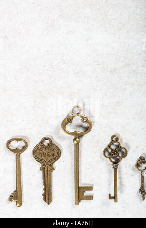 Decorative keys of different sizes and styles on grey background Stock ...