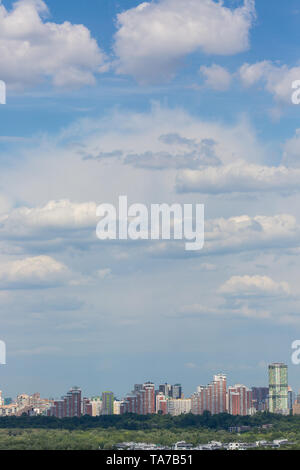 A vertical shot of the cloudy sky over the lake in spring at sunset ...