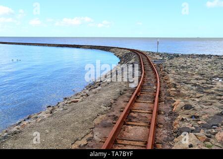 Old rusty weathered railroads right at the baltic sea coast Stock Photo ...