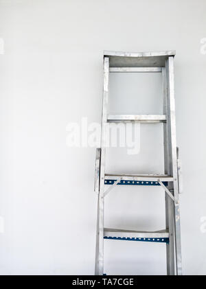 simple metal ladder on cement wall, architectural background Stock ...
