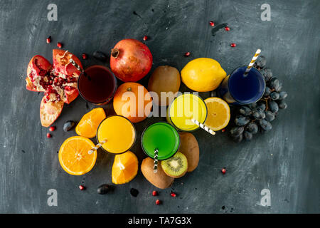 cold fresh smoothie squeezed from different tropic exotic fruits such ...