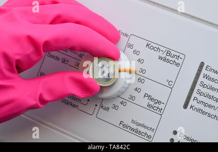 Washing machine, button, coloreds 30 degrees, one euro coin, symbolic ...
