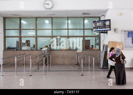 MONASTIR, TUNISIA-CIRCA MAY, 2012: Passengers come to platform in ...