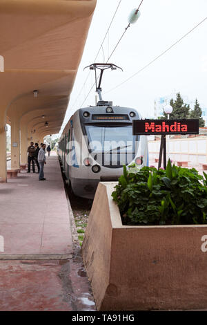 MONASTIR, TUNISIA-CIRCA MAY, 2012: Passengers come to platform in ...