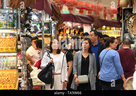 Tourists visit the Grand Bazaar in Urumqi City, northwest China's ...