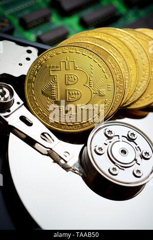 Bitcoins on a hard drive Stock Photo - Alamy
