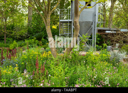 A repurposed grain silo surrounded by naturalistic planting inThe ...