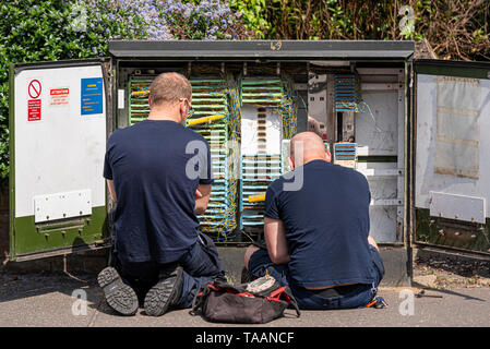 BT Openreach engineers working on a broadband internet fibre cabinet in ...