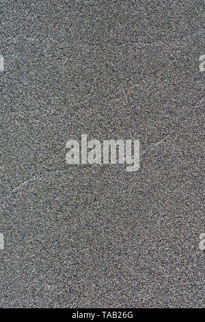 Volcanic black sand background taken in Bali Stock Photo - Alamy