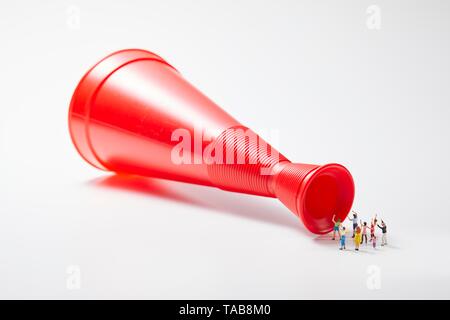 Miniature figures cheering Stock Photo - Alamy