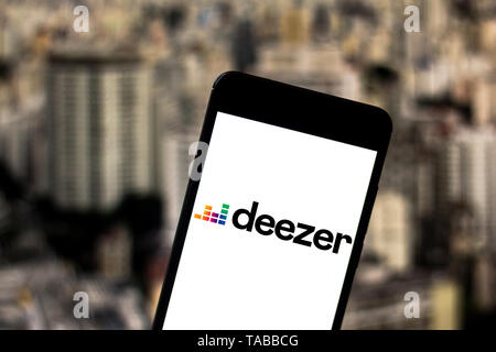 In this photo illustration, the Deezer logo is seen displayed on a ...