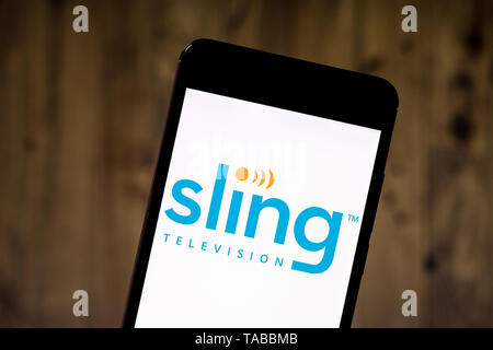 In this photo illustration, a Sling TV logo is seen displayed on a ...
