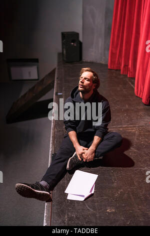 Professional actor rehearsing on stage in theatre Stock Photo - Alamy
