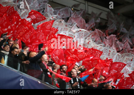 Fans in the stands wave flags during the first half of an MLS soccer ...