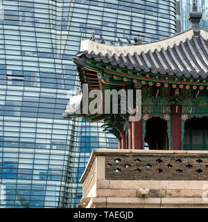 Traditional watchtower in front of skyscraper, Dongsibjagak Watchtower ...