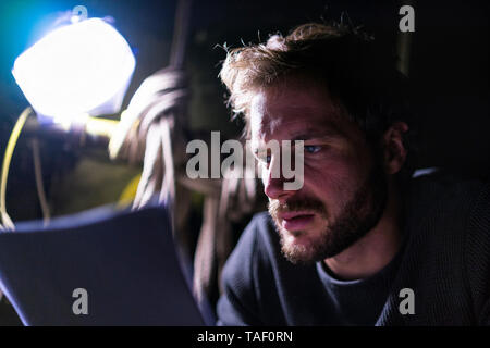 Actor at theatre studying script backstage Stock Photo - Alamy