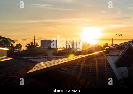 solar panel with sun hitting it Stock Photo - Alamy
