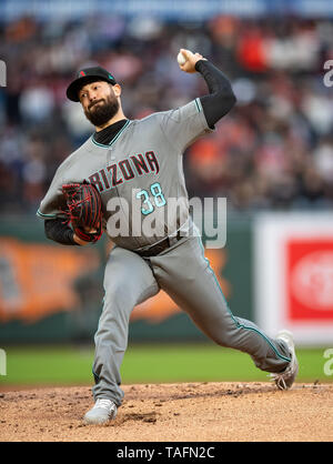 San Francisco Giants pitcher Robbie Ray reacts after a mound visit by ...