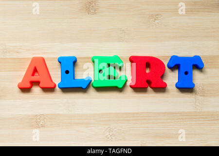 Color alphabet letter with word alert on wood background Stock Photo ...