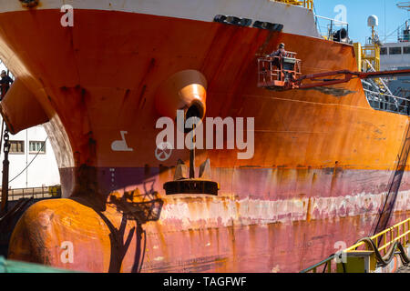 Cleaning and repainting of hulls of a big ship or big ship being fixed ...