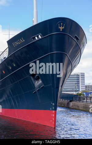 Bow and anchor of an old riveted ship with the water reflecting on the ...