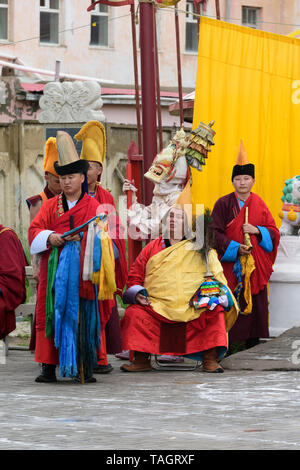 Lamas in masks and costumes participating in a religious dance (tsam ...