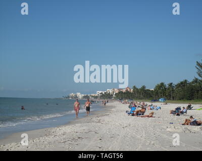 Naples Florida beach with sunbathers and swimmers Stock Photo - Alamy