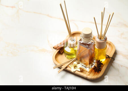 Different reed diffusers on table Stock Photo - Alamy