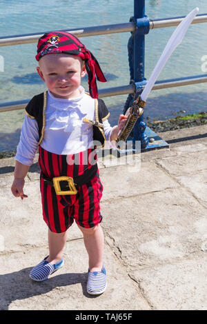 Kids dressed in pirate costumes and hats with treasure chest ...