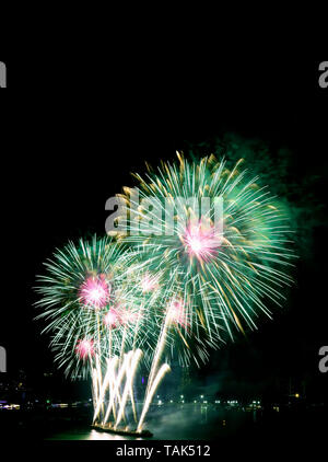 Vertical image of a fireworks show with pyrotechnics launched at ...