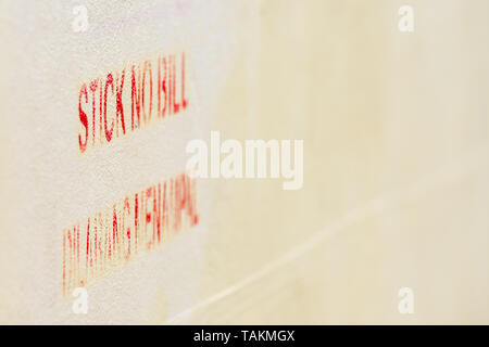 "stick no bills" sign painted on a wall, no bill posting, in two ...