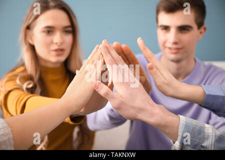 People putting hands together as symbol of unity on white background ...