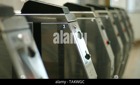 Modern baffle gate or turnstile Stock Photo - Alamy