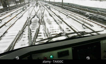 Train driver's cockpit view, from inside cab, through the window of a ...