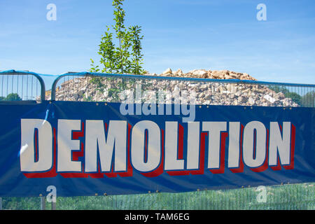 large pile of bricks, concrete and rubble at excavation building site ...