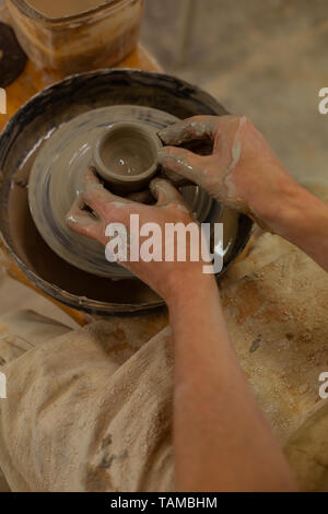 shaped clay in a pottery class, enjoying meaningful moments, banner ...